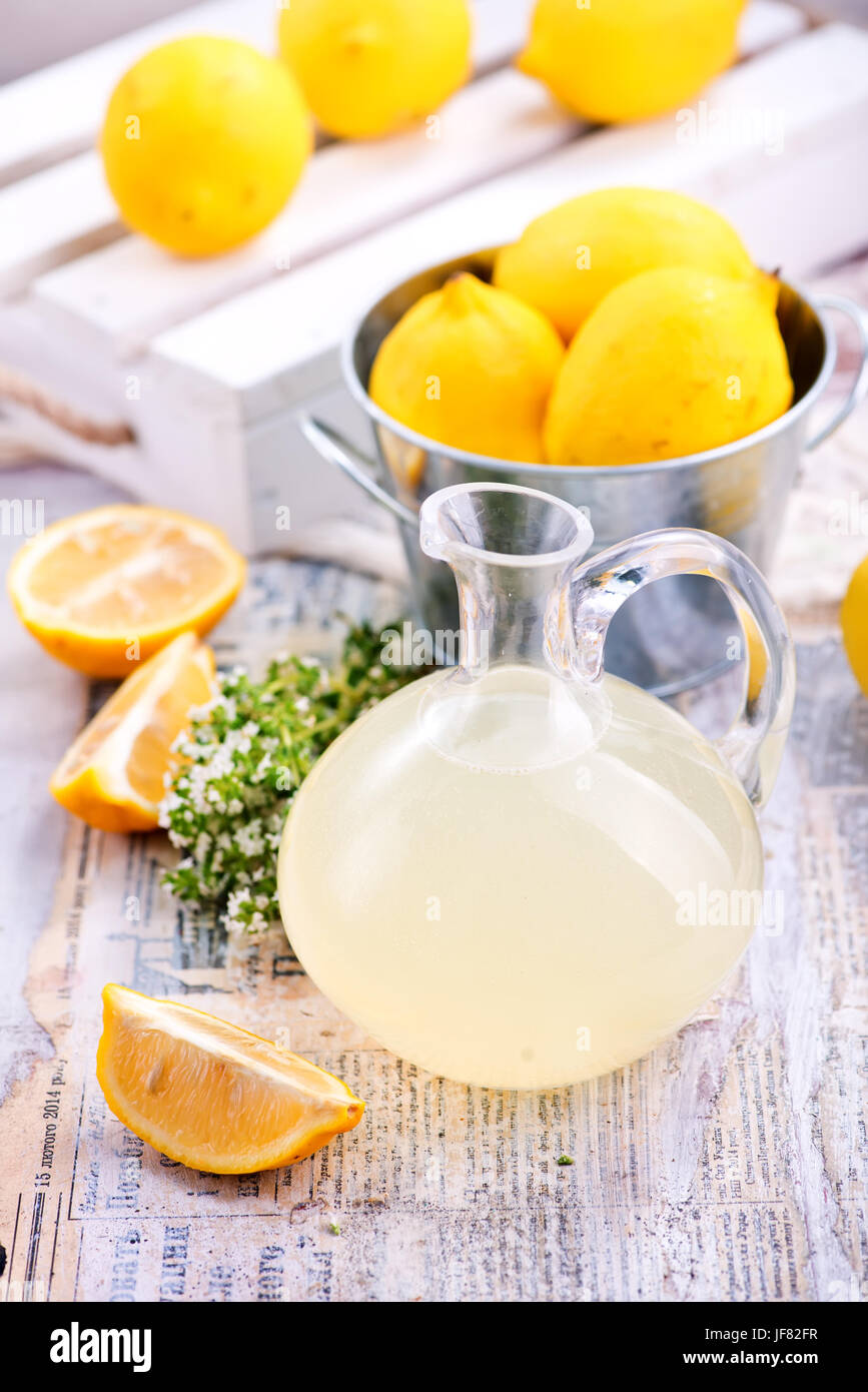 fresh lemon drink in glass jug and on a table Stock Photo - Alamy