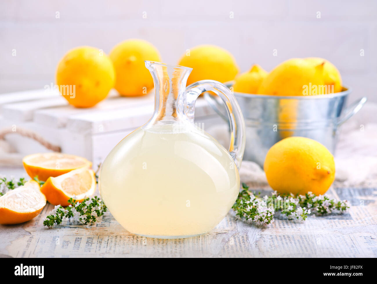 fresh lemon drink in glass jug and on a table Stock Photo - Alamy