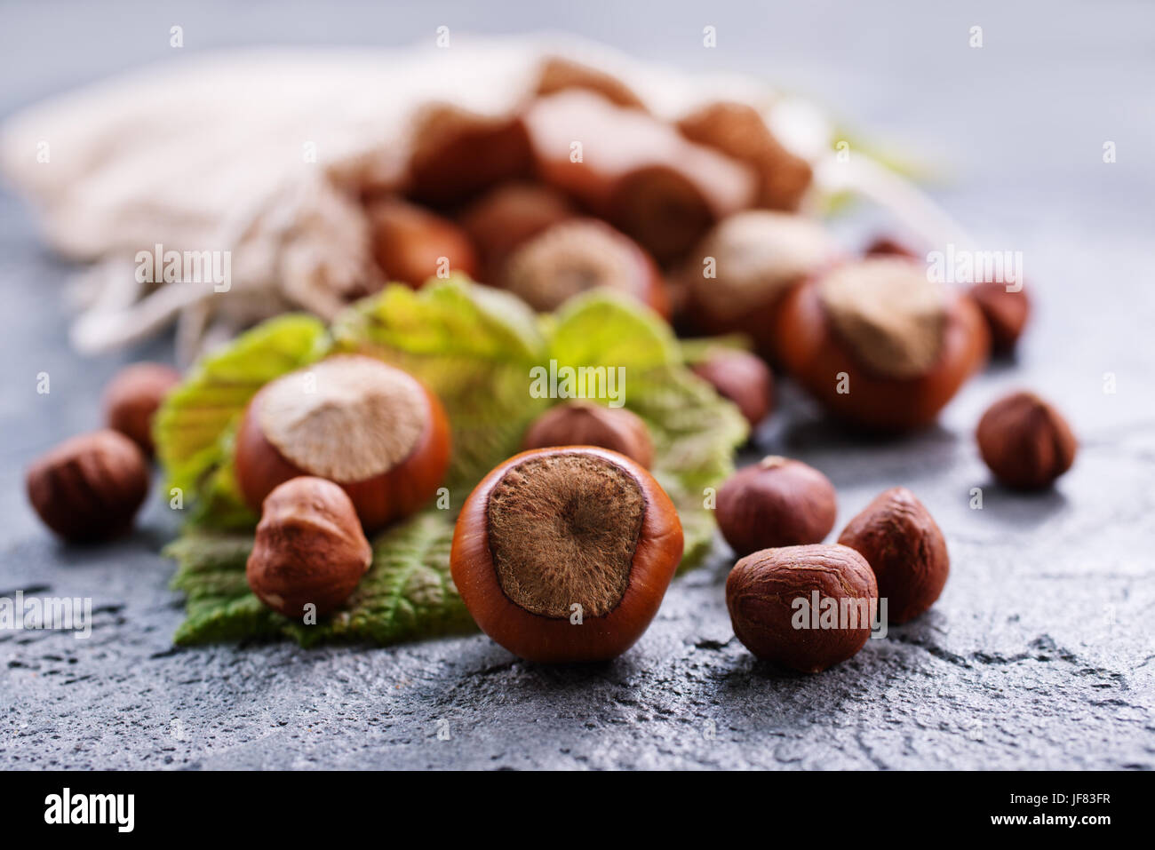 hazelnuts in bag and on a table Stock Photo - Alamy