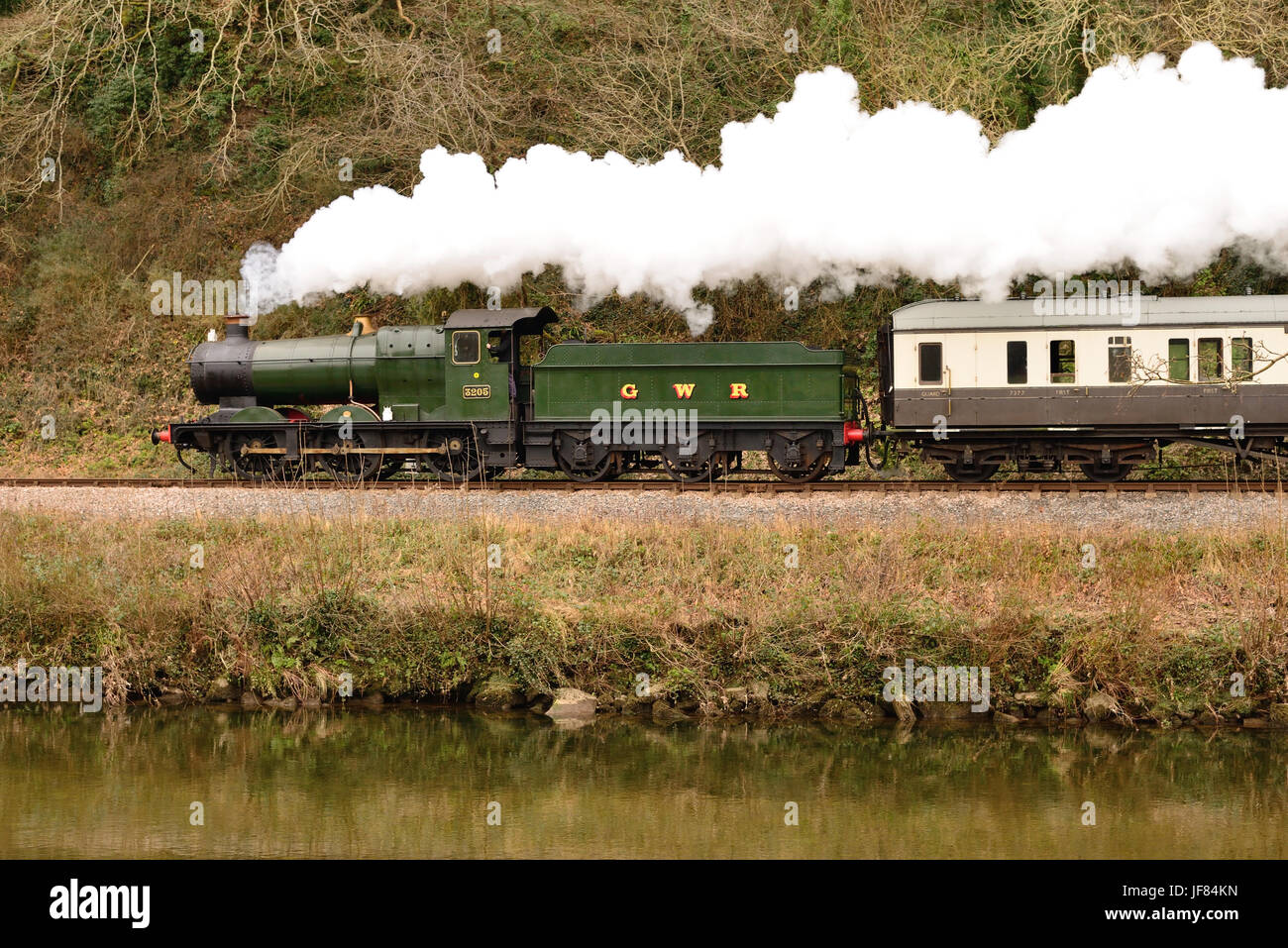 Steam train on the South Devon Railway alongside the river Dart, hauled ...