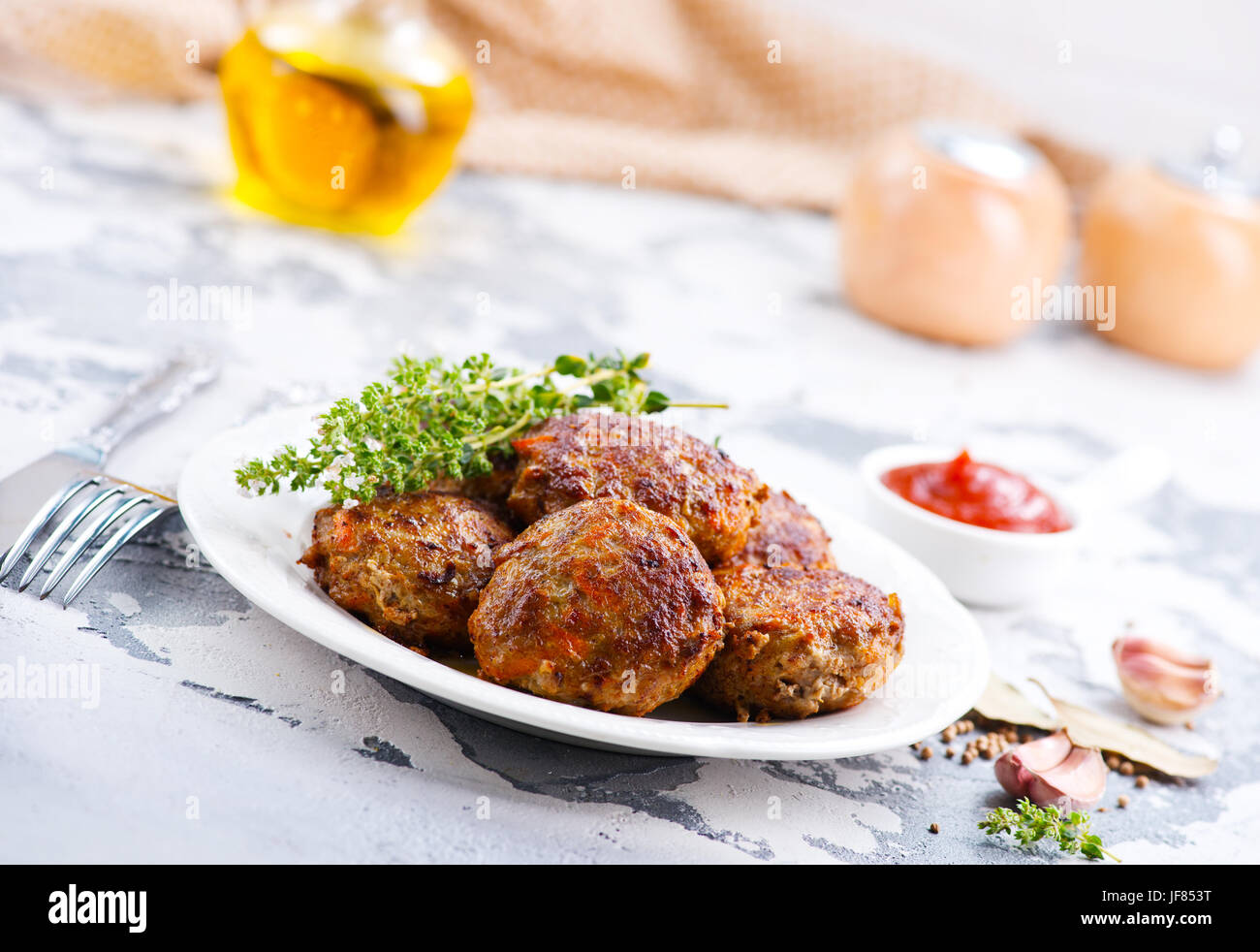meatballs on plate and on a table Stock Photo - Alamy