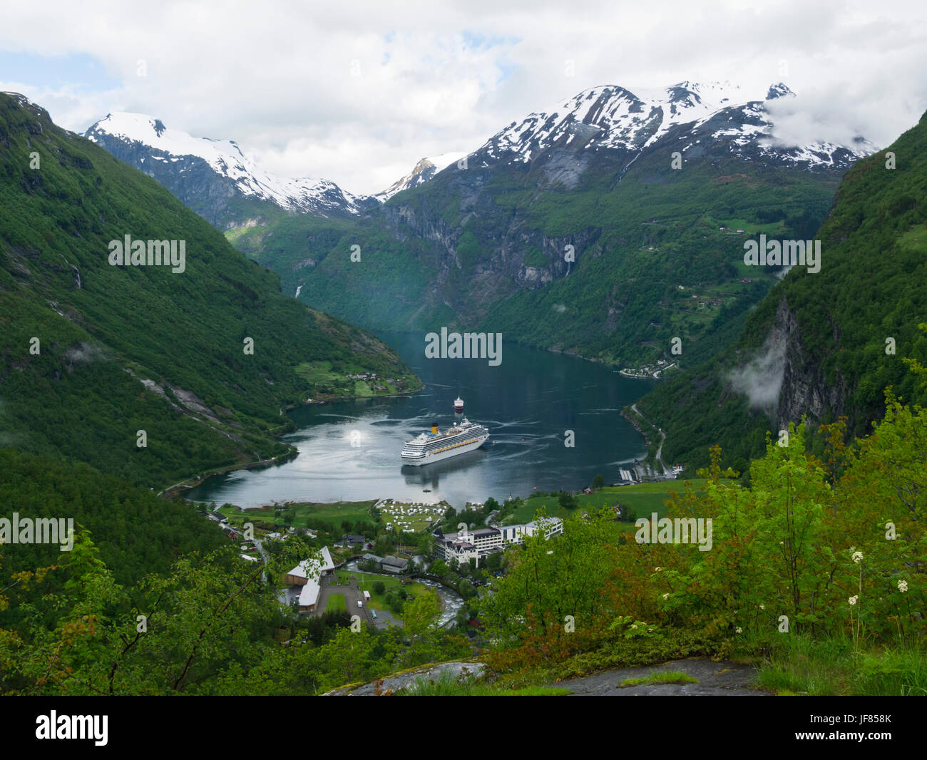 View down to attractive Geiranger village and cruise ship in ...