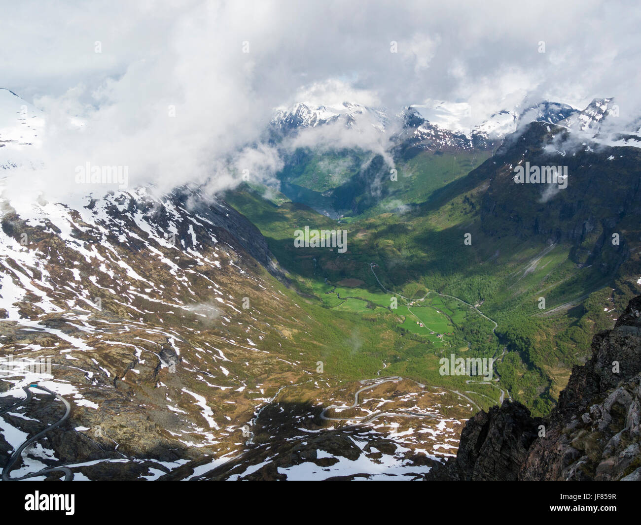 Looking down to Geiranger village and Geirangerfjorden from Mount ...