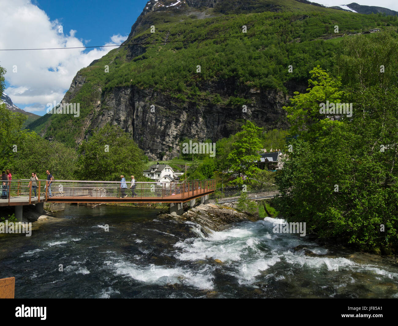 An elevated pedestrian walkway over Geirangelva river in the beautiful ...