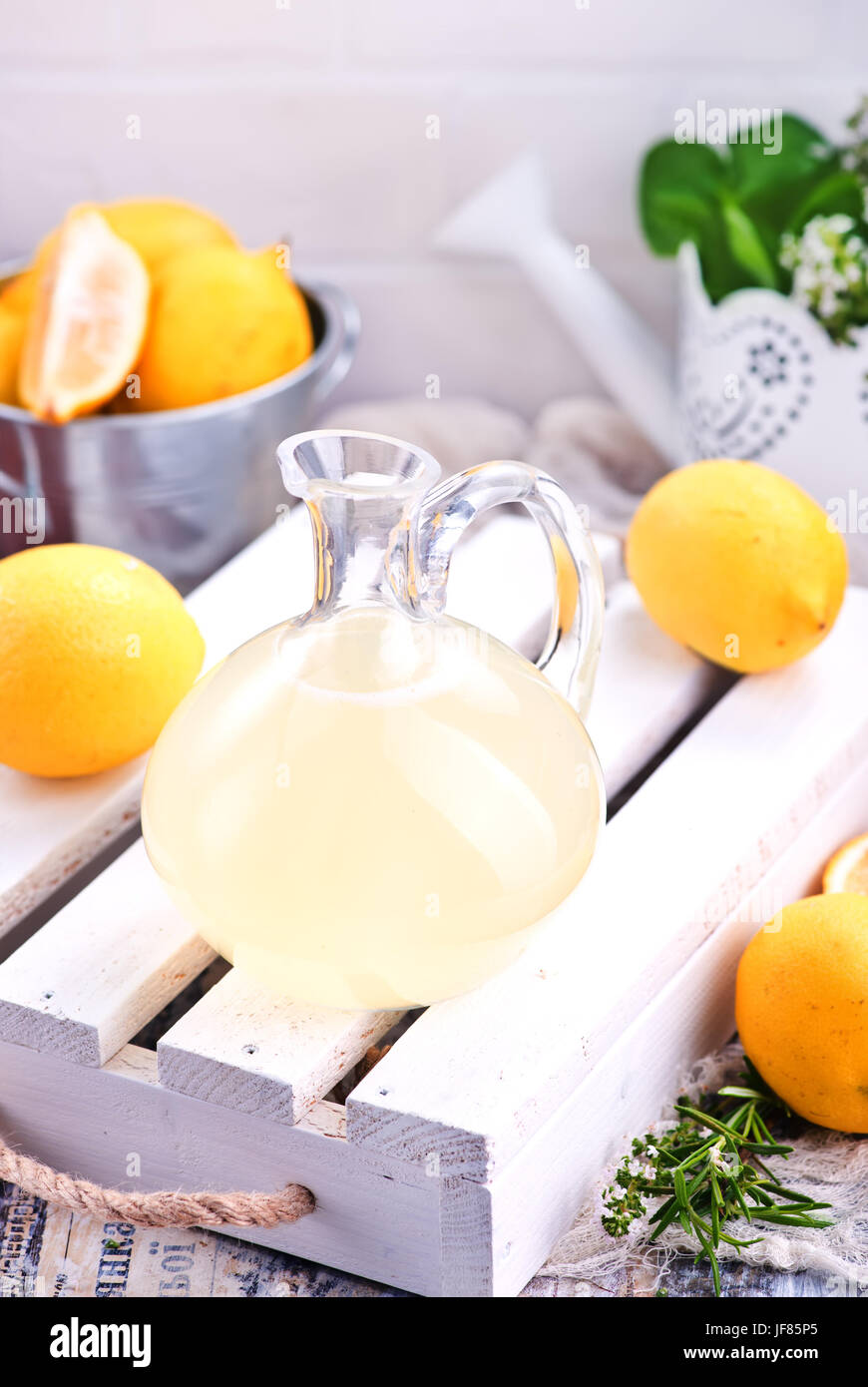 fresh lemon drink in glass jug and on a table Stock Photo - Alamy