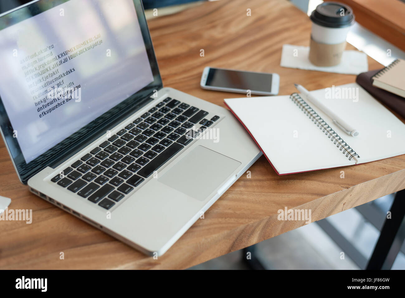 Notebook and laptop computer on able in office. Portable and mobile ...