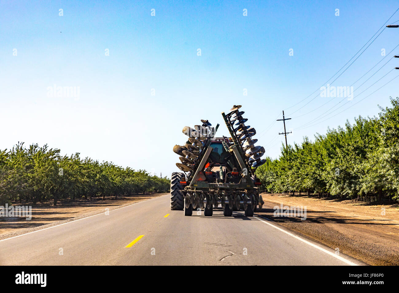 A very large tractor with disc attachment on River Road in Stanislaus ...