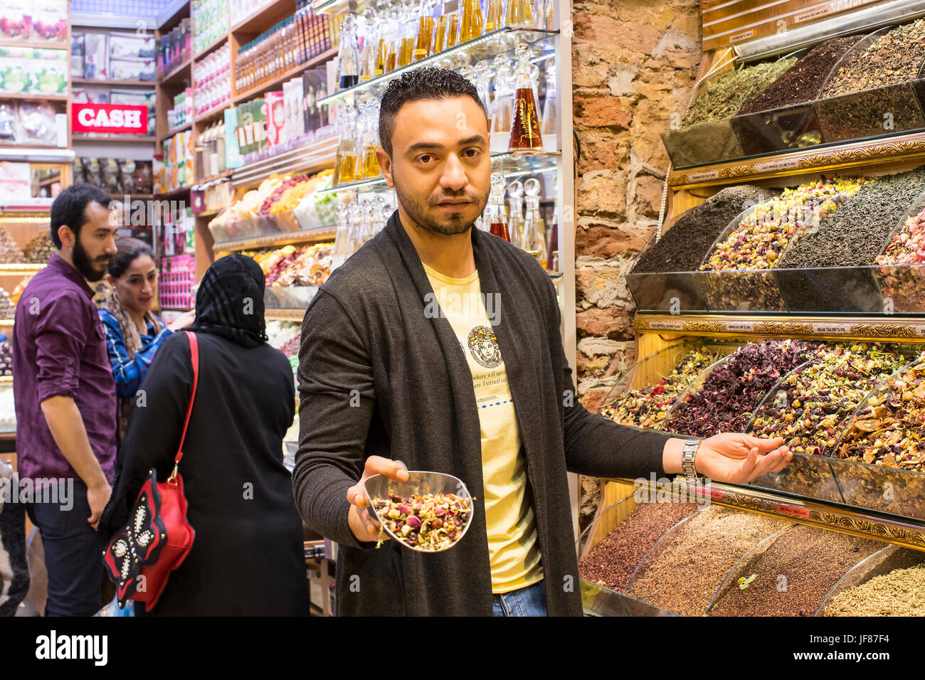 ISTANBUL, TURKEY - 7 APRIL , 2017: Sellers of spices and sweets in the ...