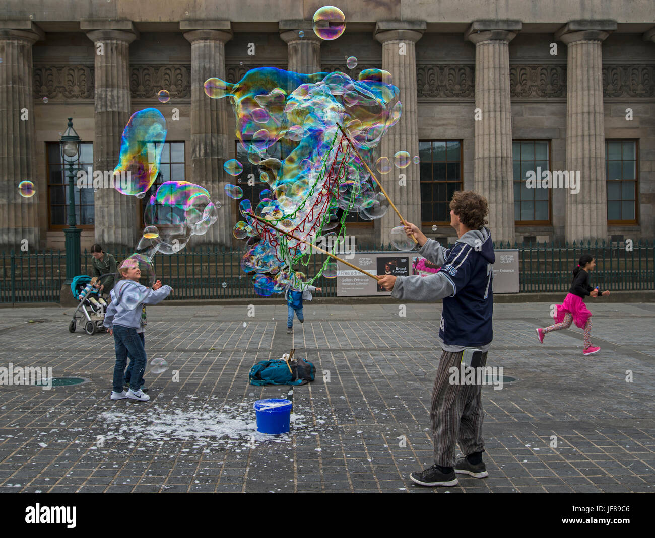 Children playing bubbles hi-res stock photography and images - Alamy