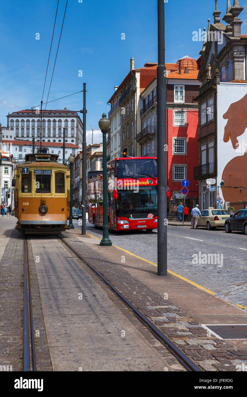 Tram and tourist sightseeing bus in Porto, Portugal Stock Photo - Alamy