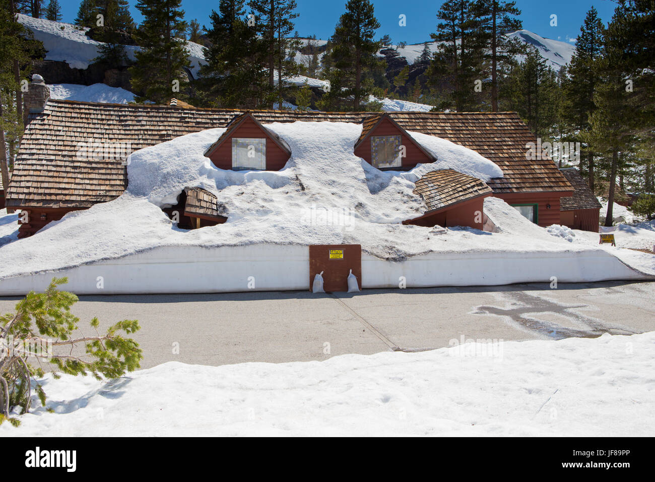 Roof and structure damage to the lodge building at Tioga Pass Resort ...