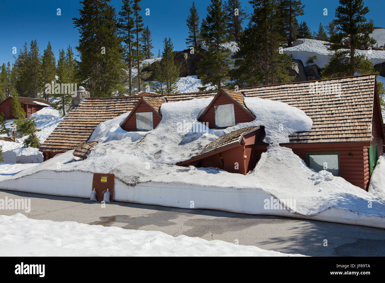Roof and structure damage to the lodge building at Tioga Pass Resort ...
