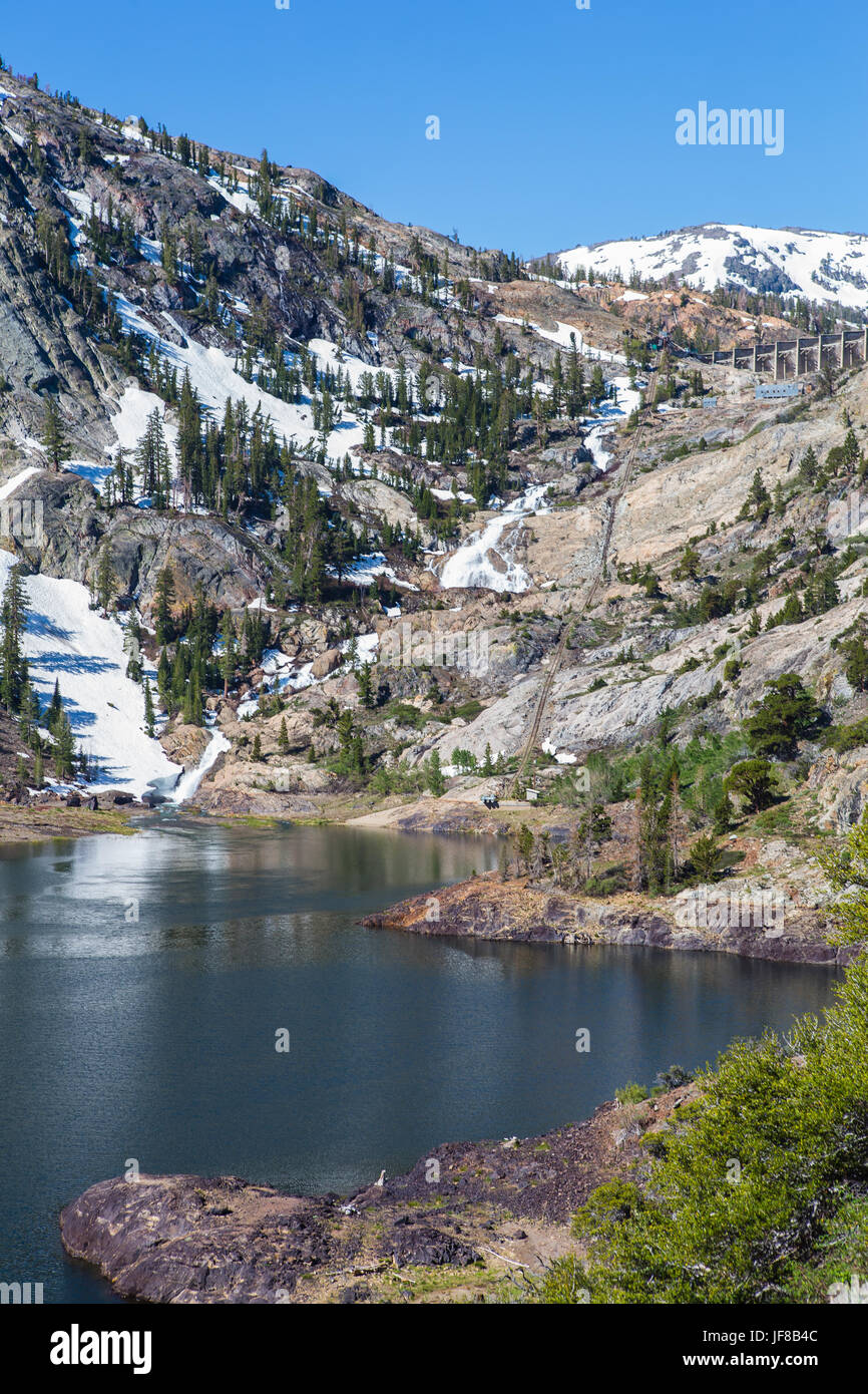 Agnew lake with Gem lake dam high up in the distance of the Sierra ...