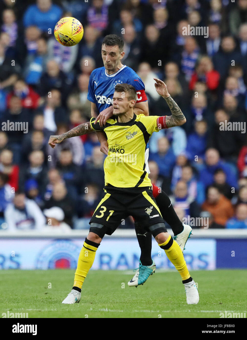Rangers' Lee Wallace (left) challenges Progres Niederkorn's Sebastien ...