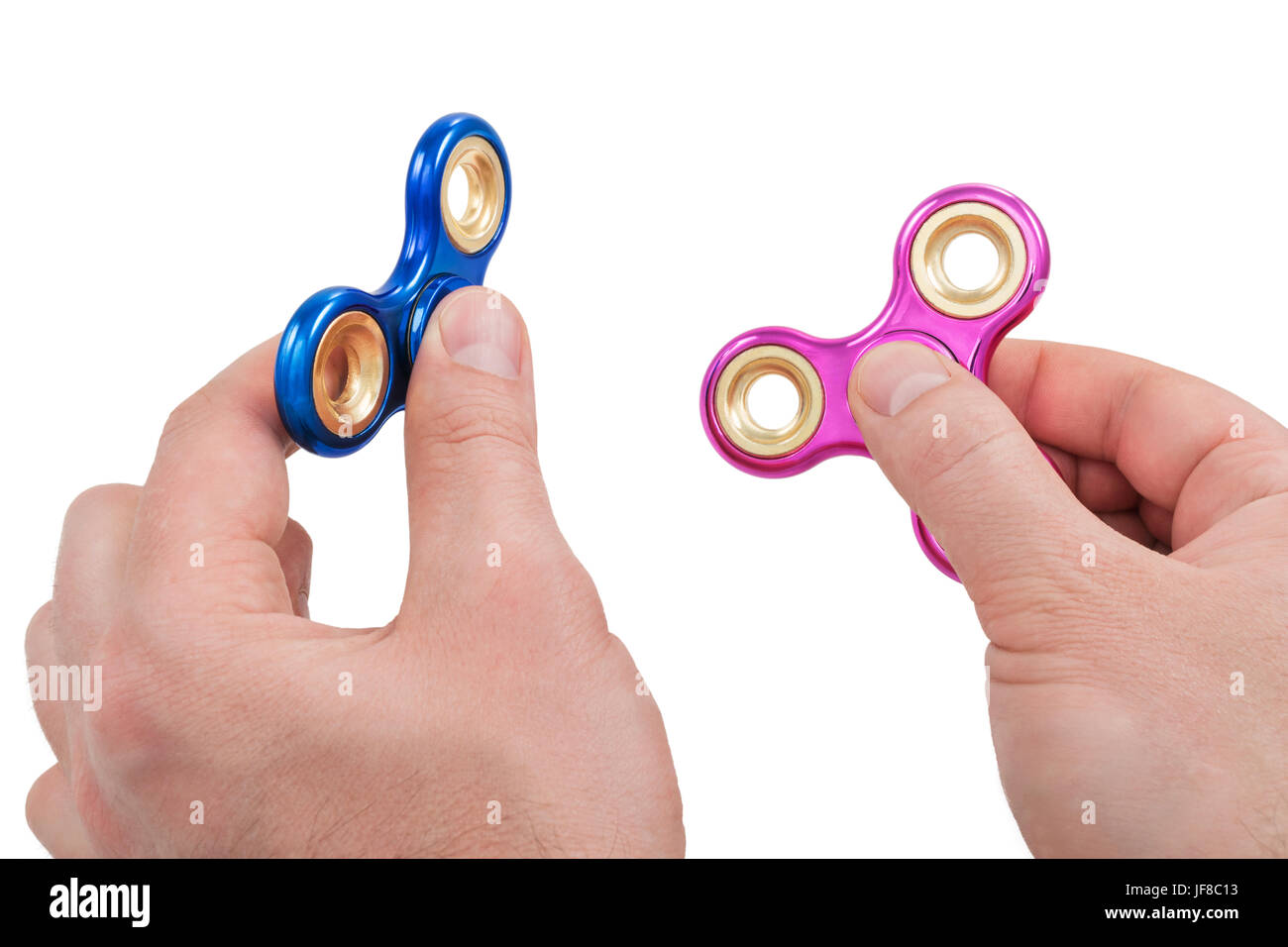 Two spinners in male hands isolated on white background Stock Photo - Alamy