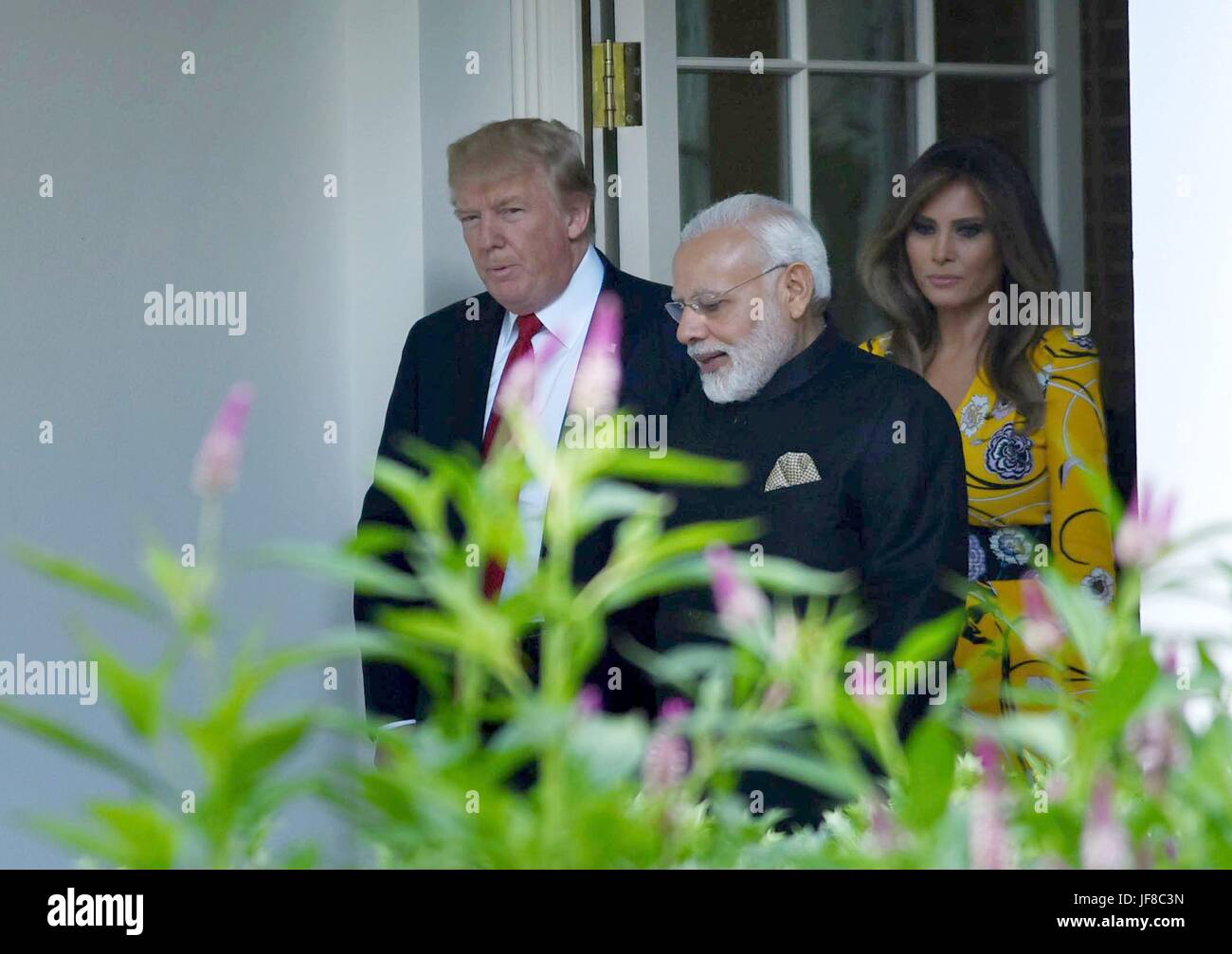 Indian Prime Minister Narendra Modi, center, walks with U.S. President ...