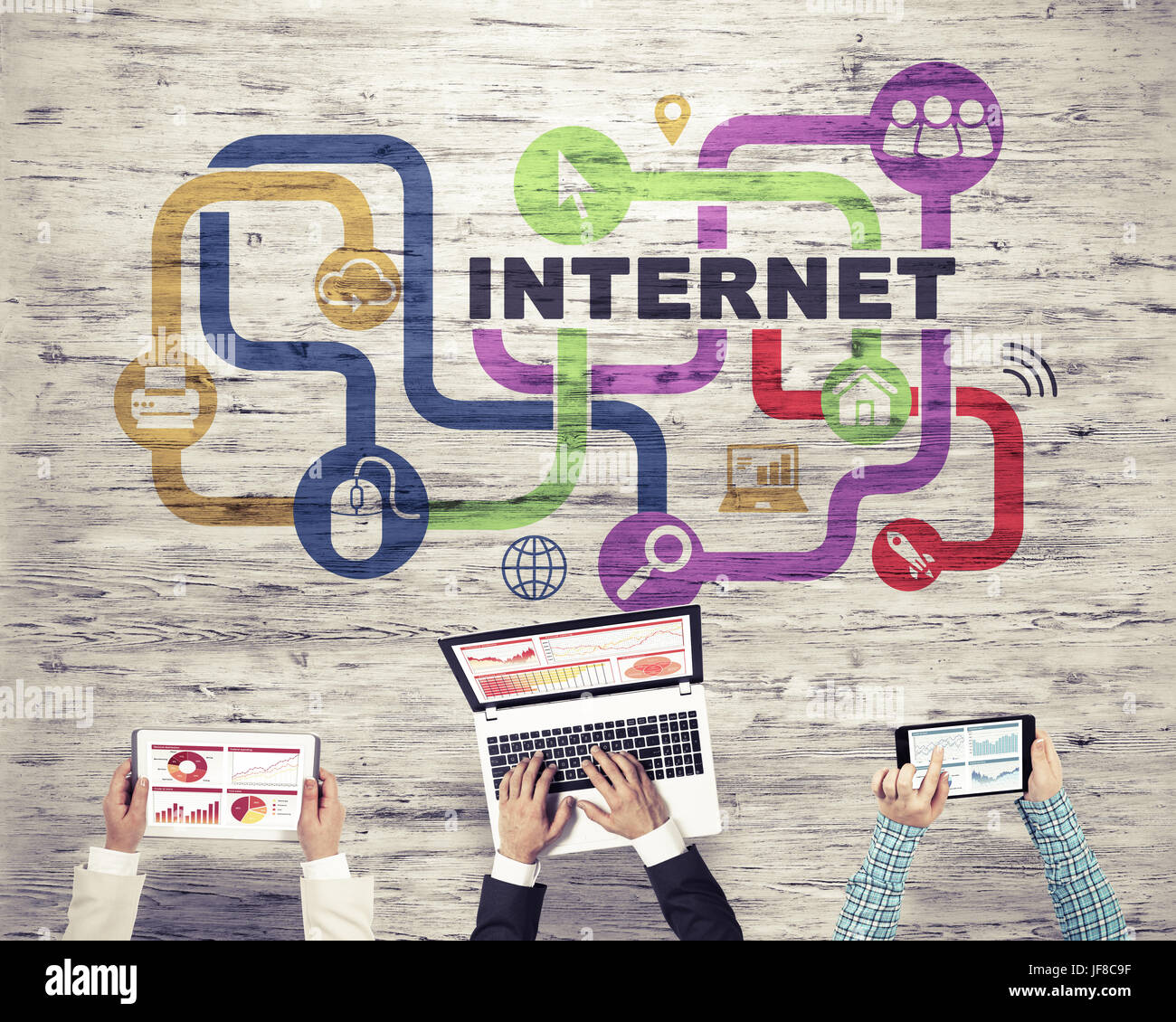 Group of three people with devices in hands working together as symbol ...