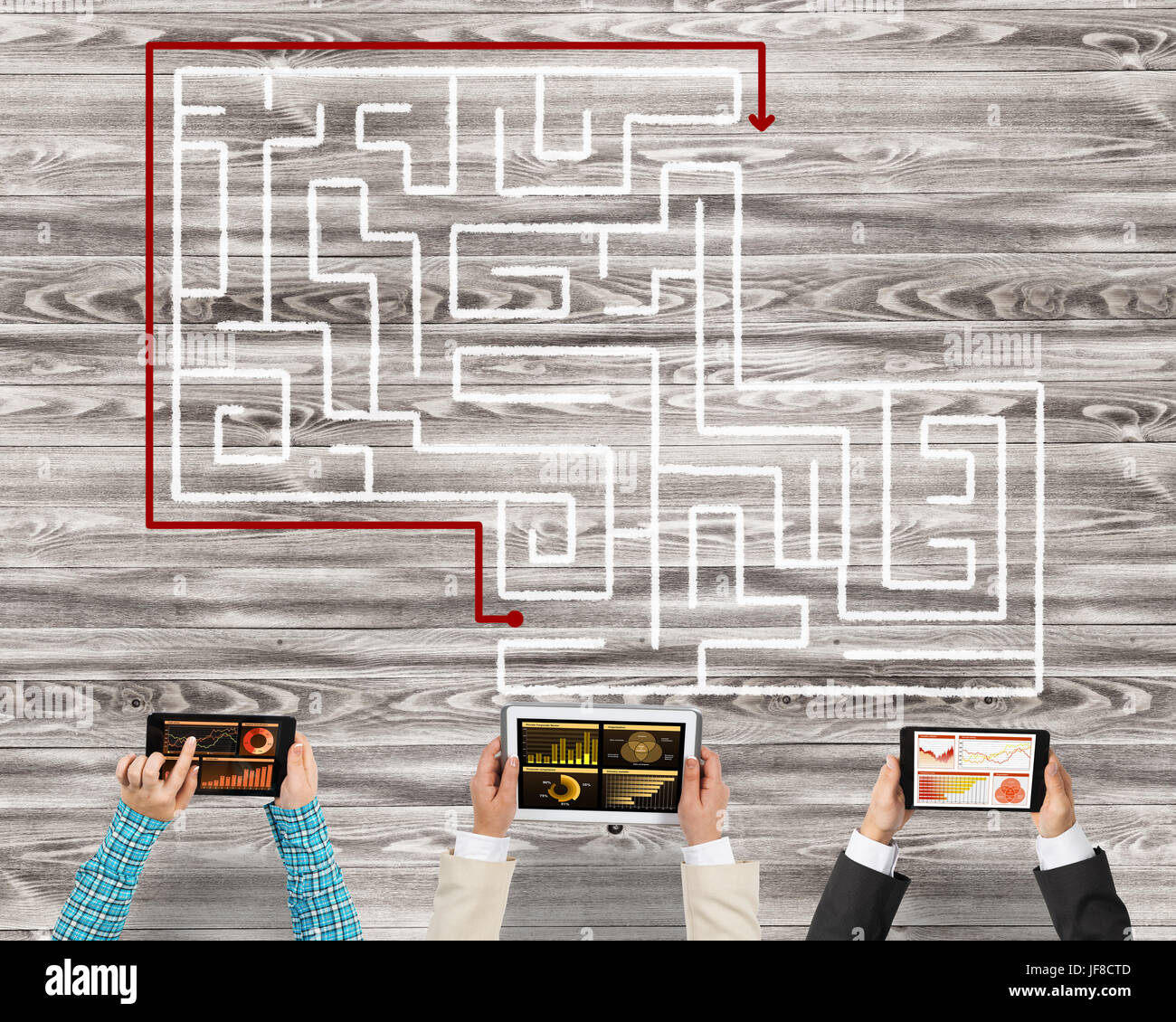 Group of people with devices in hands working together to find right ...