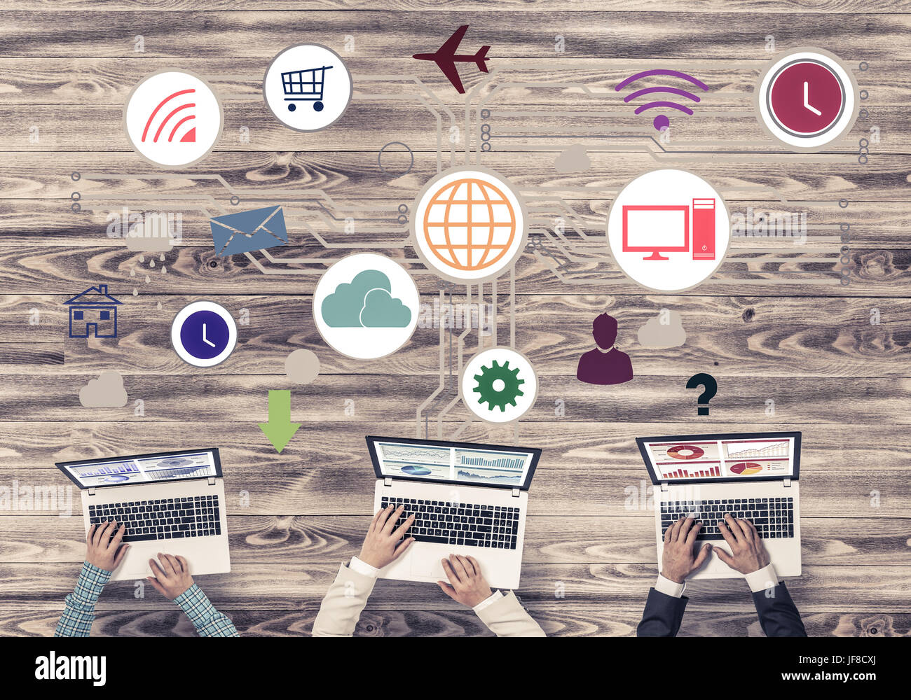 Group of three people with devices in hands working together as symbol ...