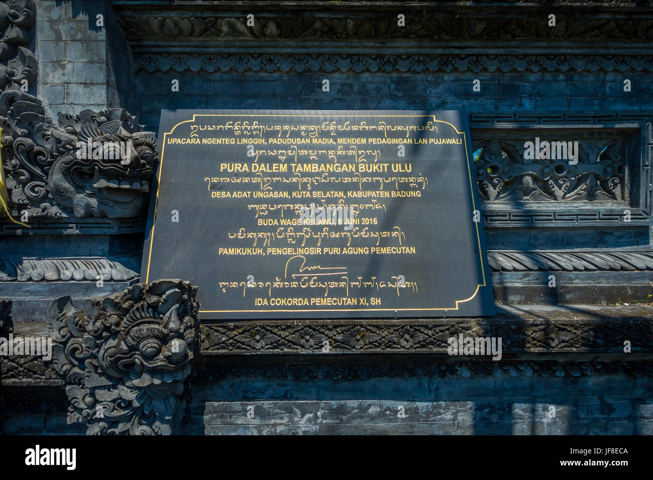 BALI, INDONESIA - MARCH 11, 2017: An informative sign on stone in Bali ...