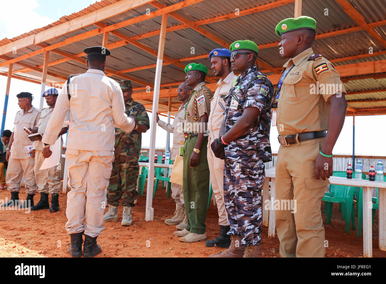 A Somali Police officer receives a certificate after completing a close ...
