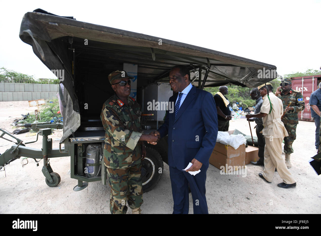 Ambassador Francisco Madeira and Maj. Gen. Mohamed Ahmed Jimaale shake ...