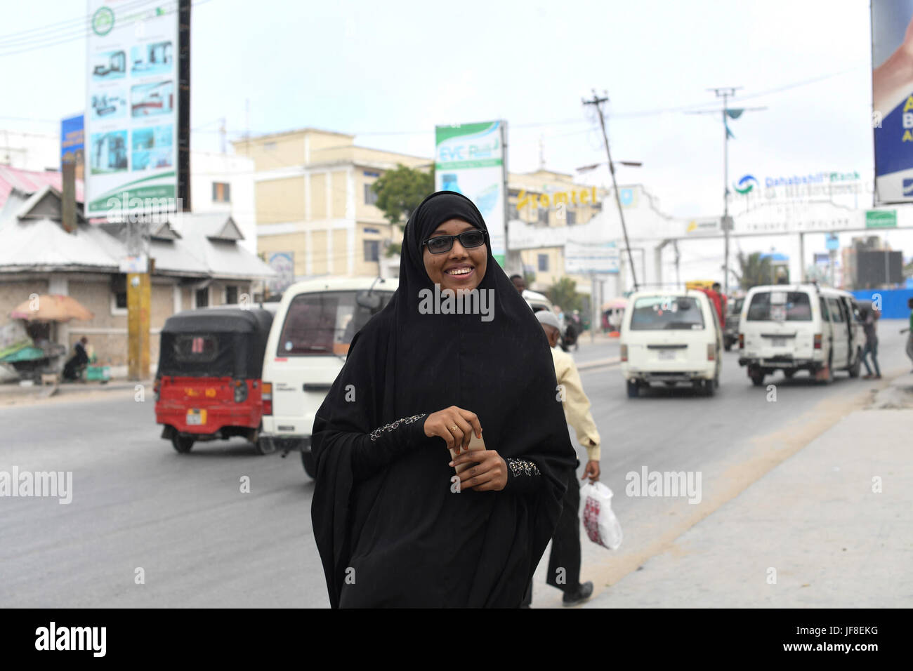 Ifrah Mohamed, a student at City University, stands on the sidewalk of ...