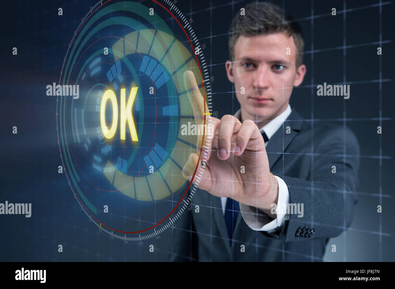 Businessman pressing virtual button OK Stock Photo - Alamy