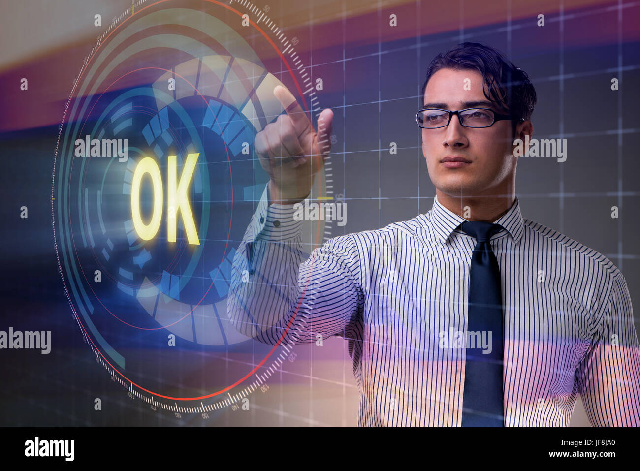 Businessman pressing virtual button OK Stock Photo - Alamy