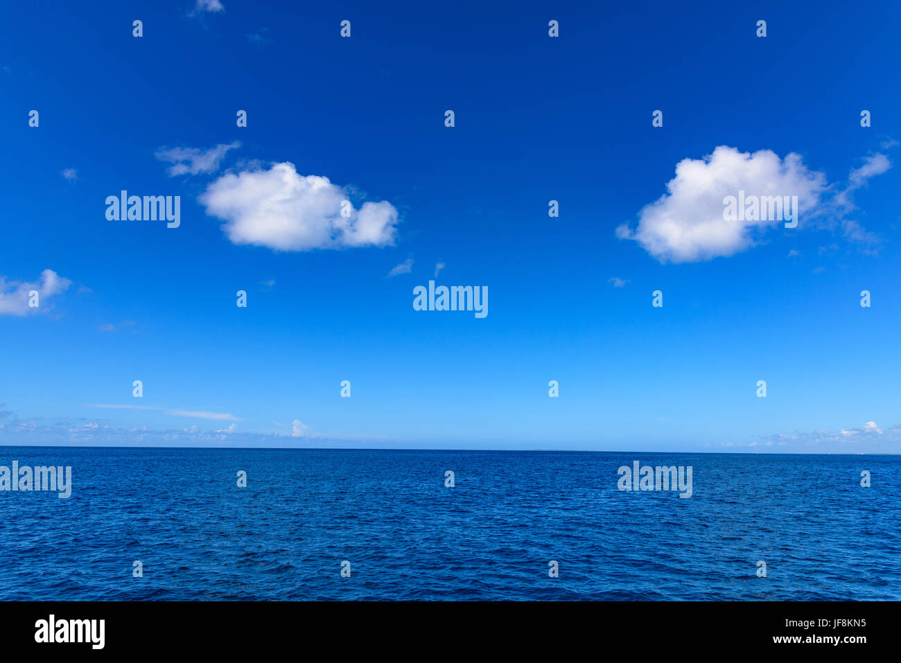 open blue sea cumulus clouds Stock Photo - Alamy