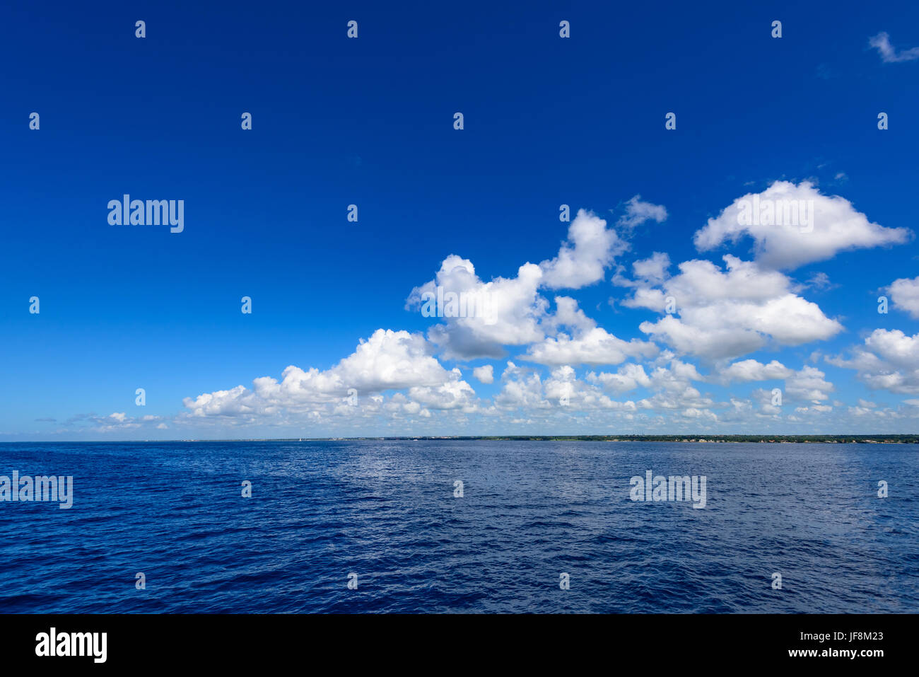 open blue sea cumulus clouds Stock Photo - Alamy