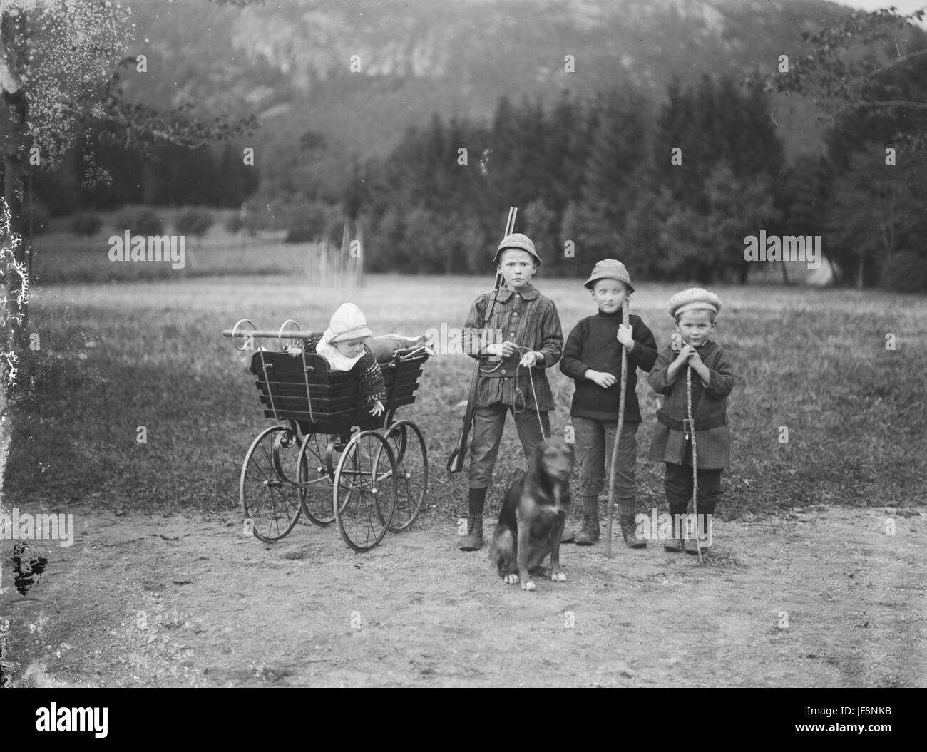 A charming portrait of children from the early 20th century, captured ...