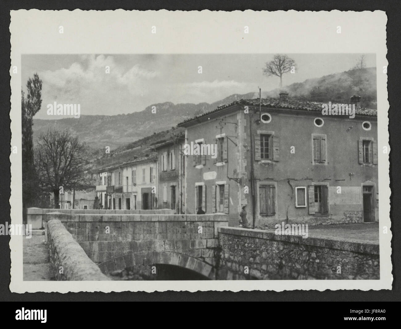 A historical photograph of the Pont sur le Roubion bridge in the center ...
