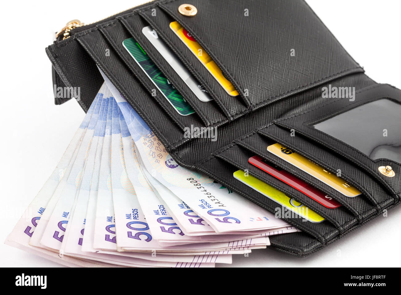 Black wallet filled with fifty thousand Colombian pesos bills Stock ...