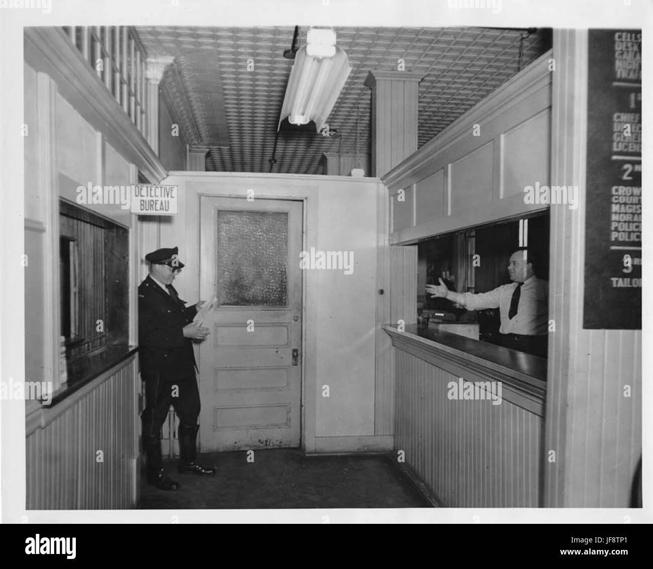 A historic photograph of the reception hall and information desk at the ...
