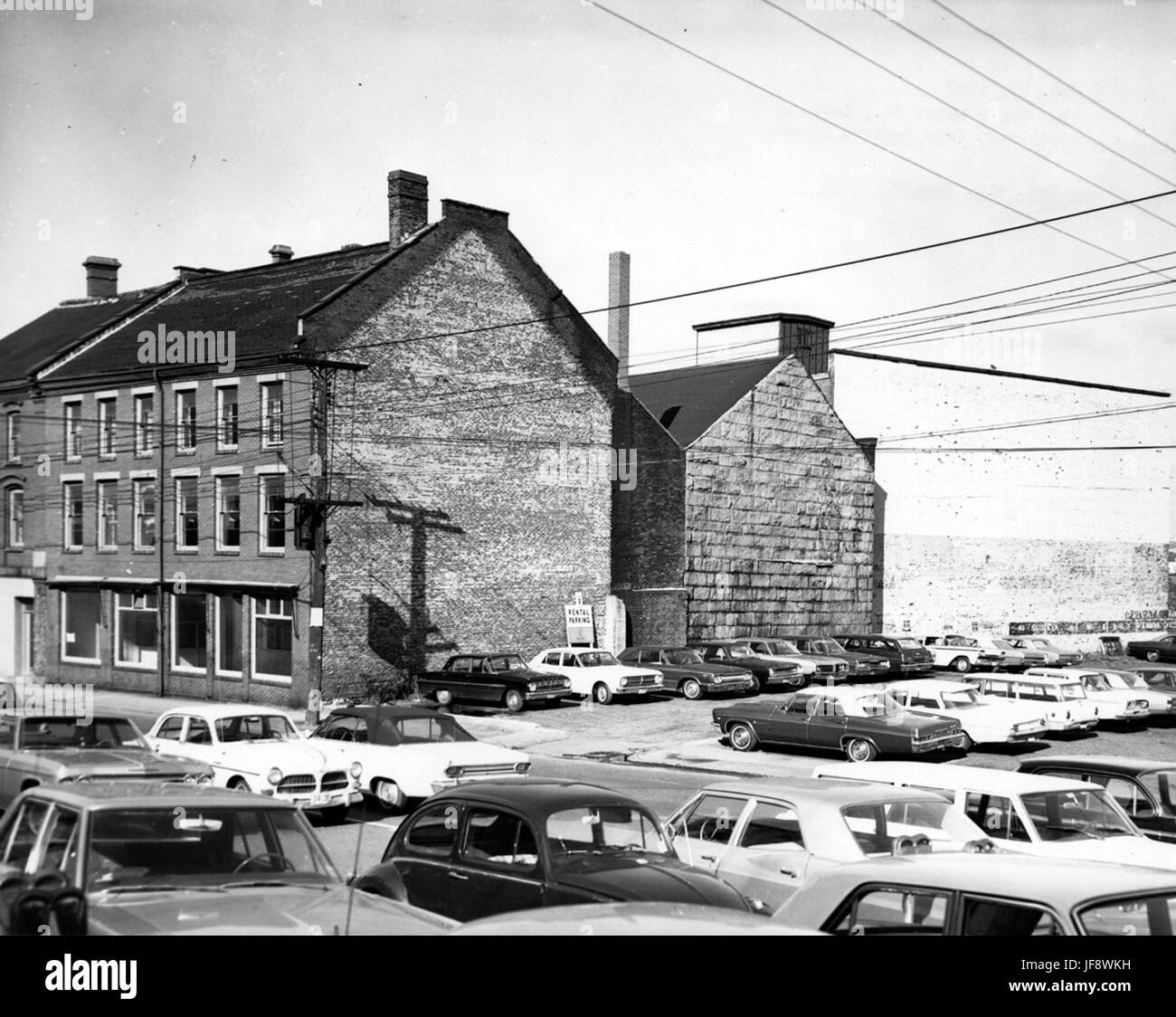 This historical photograph shows a view of Upper Water Street in ...
