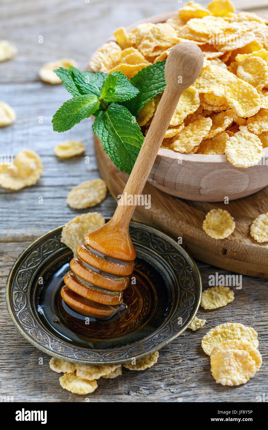 Corn flakes coated with honey Stock Photo - Alamy