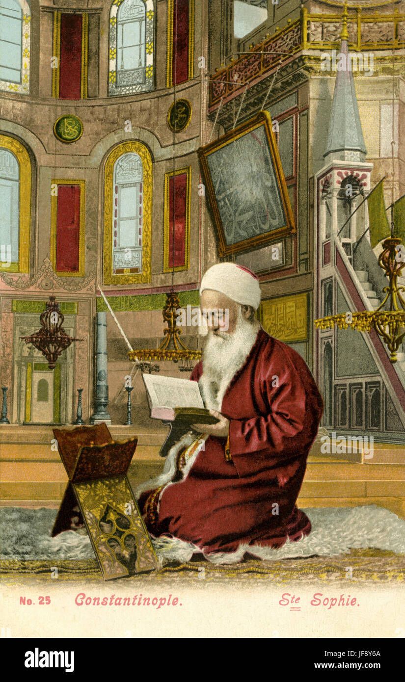 Imam reading from the Quran (Koran) with a rehal / Quran stand in the ...