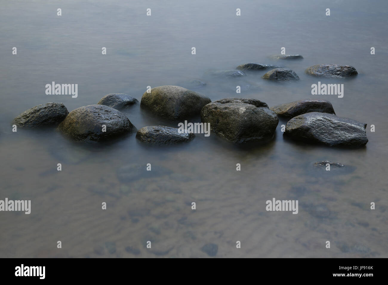 Stones in Surf Long Exposure Photo Stock Photo - Alamy