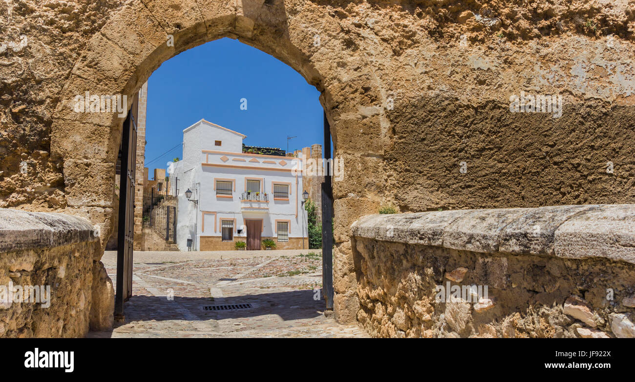 Panorama of the entrance gate to the castle square in Bunol, Spain ...