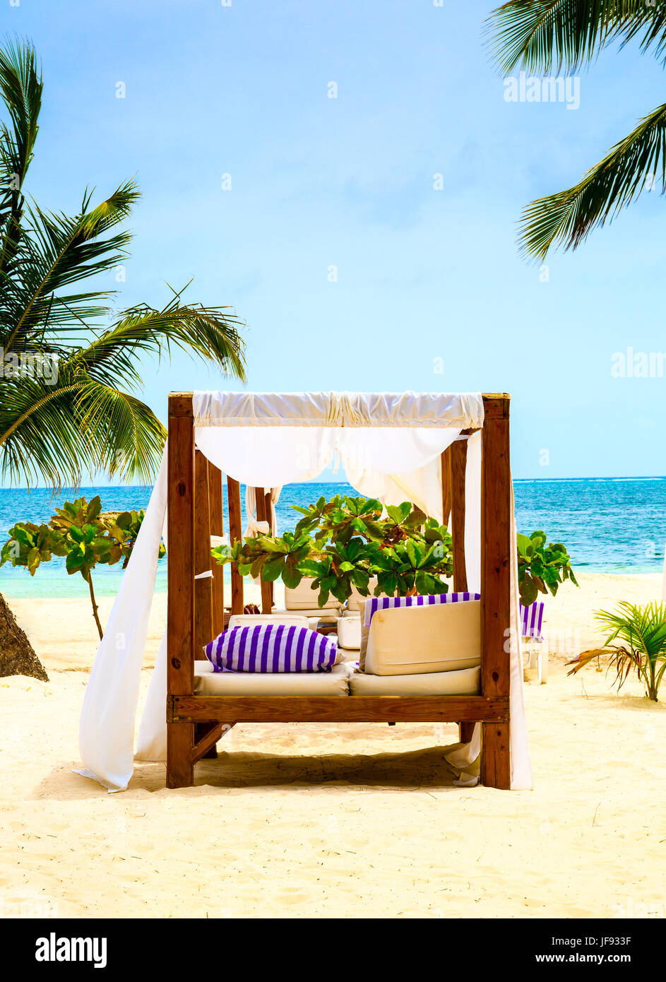 Relax on a luxury VIP beach with nice pavilion in a sunshine blue sky ...