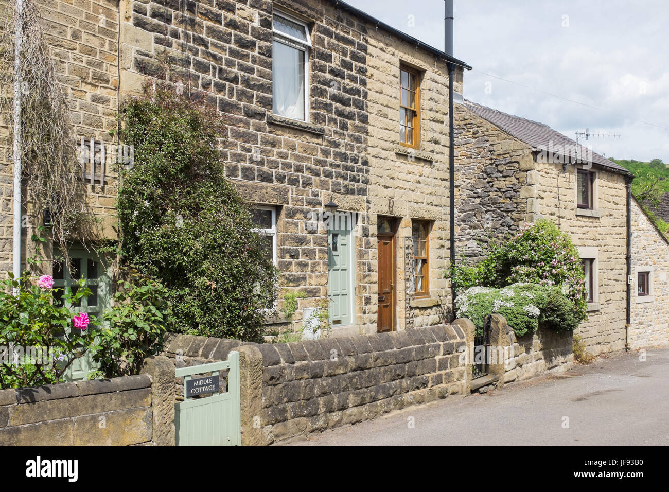 Row of stone cottages in the village of Eyam in the Derbyshire Peak ...