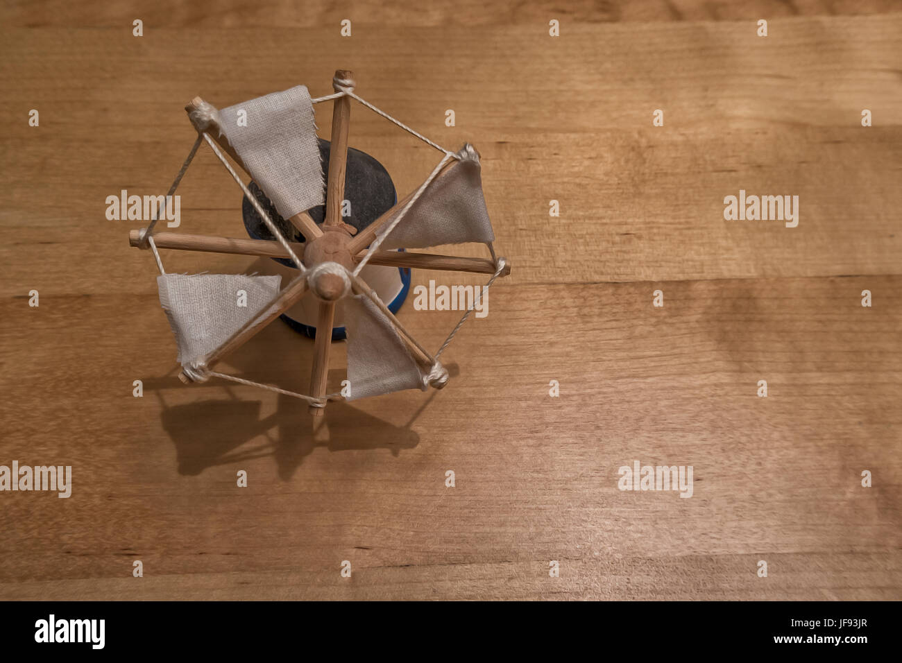 Miniature holland characteristic windmill isolated on wooden background ...