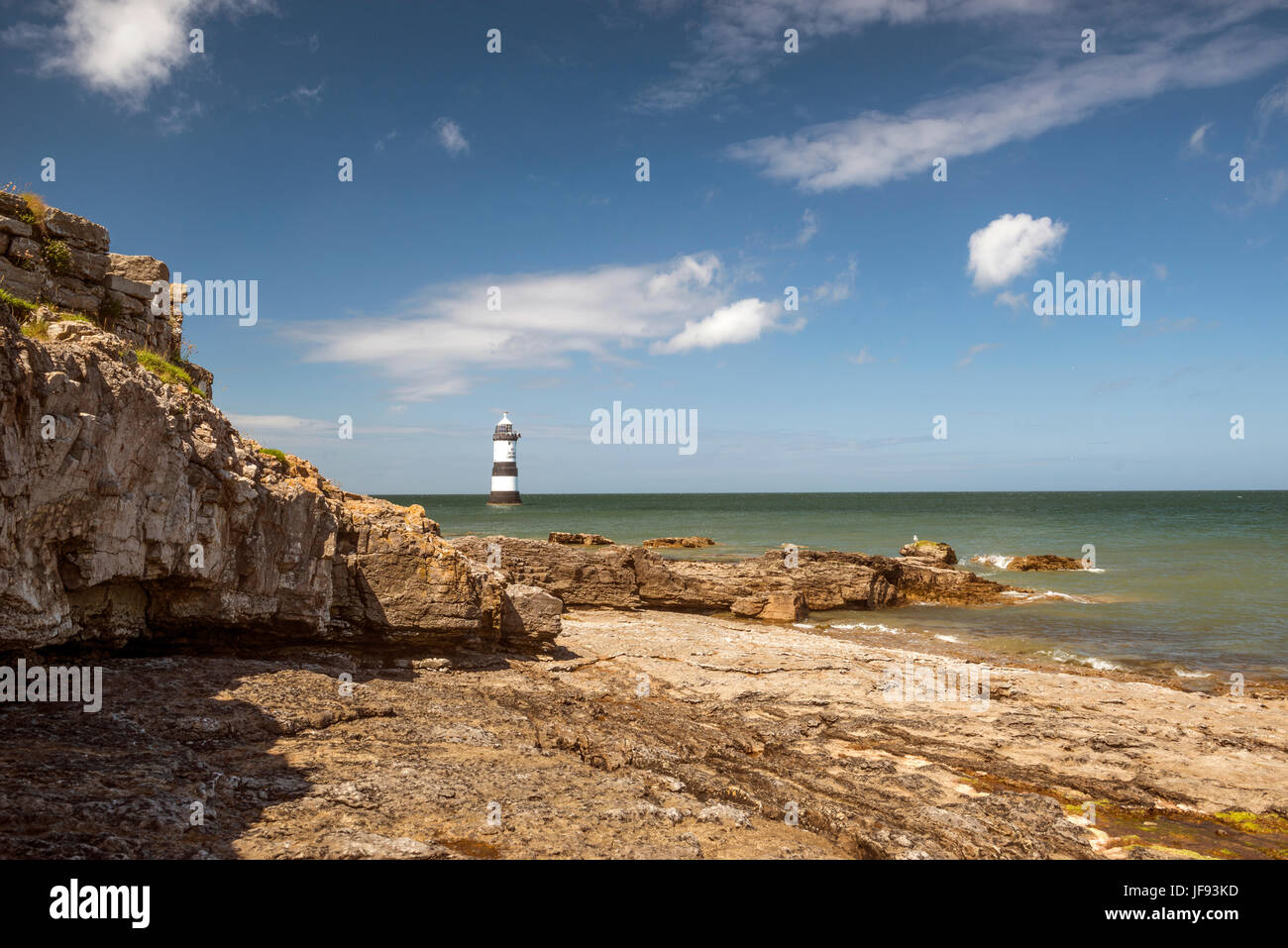 Beautiful seascape depicting Penmon Lighthouse and surrounding coastal ...