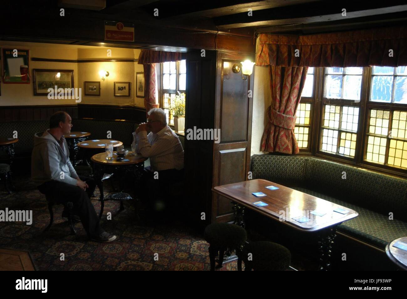 Men having a drink in a pub Stock Photo - Alamy