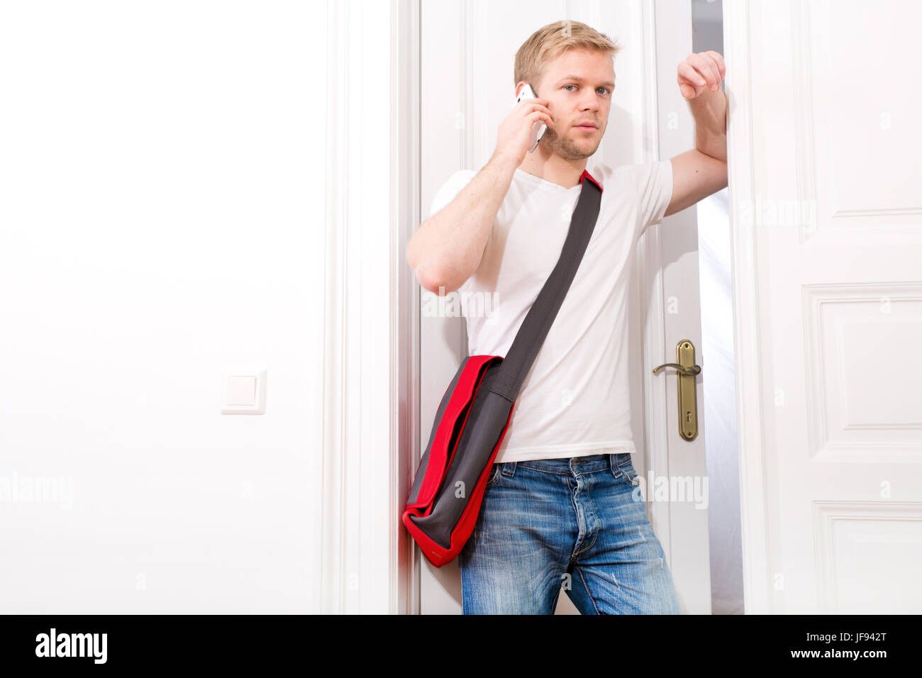 Busy student coming home Stock Photo - Alamy