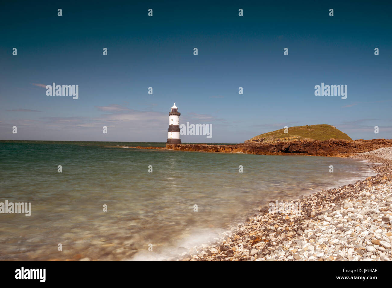 Beautiful seascape depicting Penmon Lighthouse and surrounding coastal ...