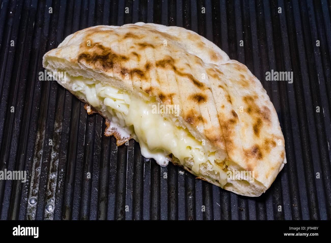 Closeup of Turkish toast (Tost), toasted sandwich with cheddar cheese ...