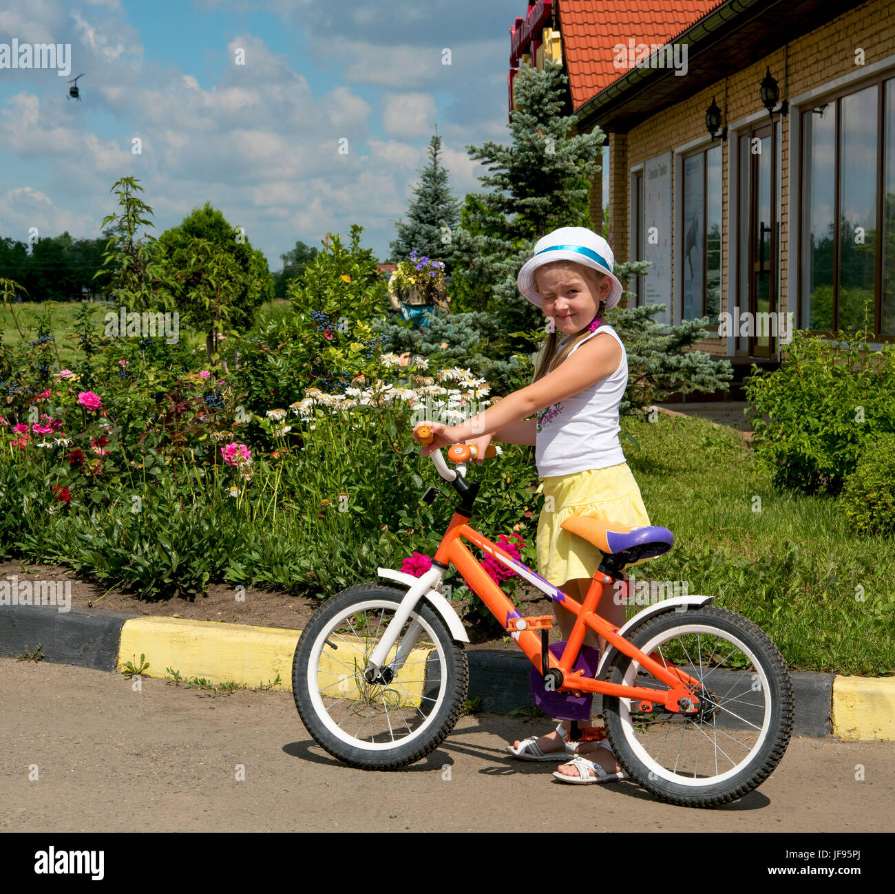 girl on a Bicycle in the Park day Stock Photo - Alamy
