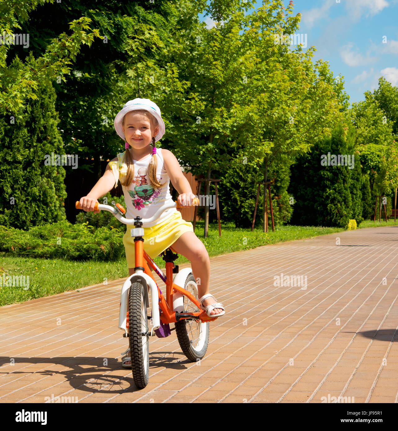 happy child on a Bicycle in the Park day Stock Photo - Alamy